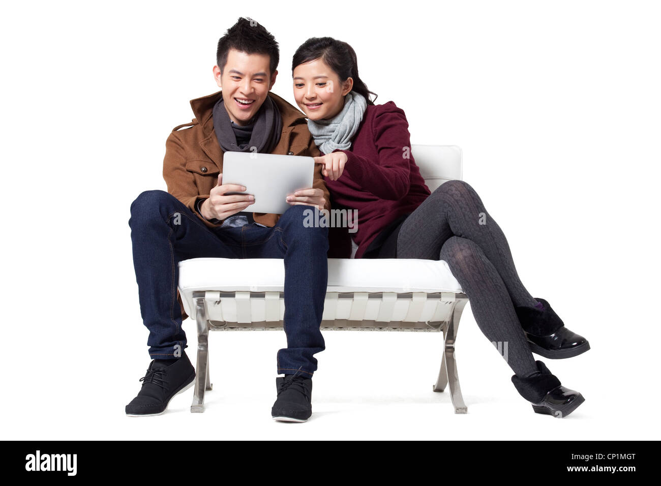 Women using digital device Cut Out Stock Images & Pictures - Alamy