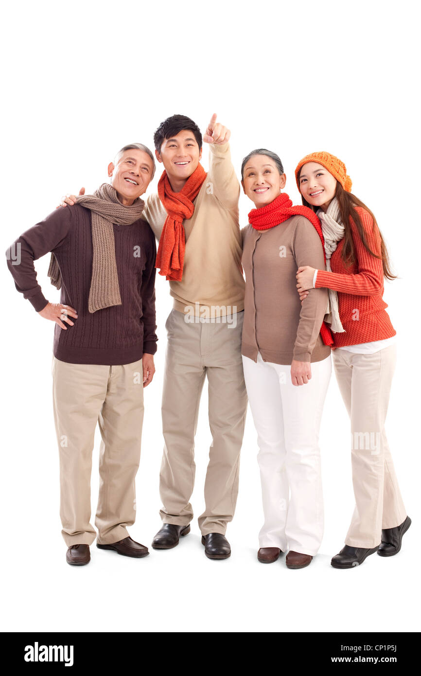Family members looking afar and pointing the front Stock Photo - Alamy