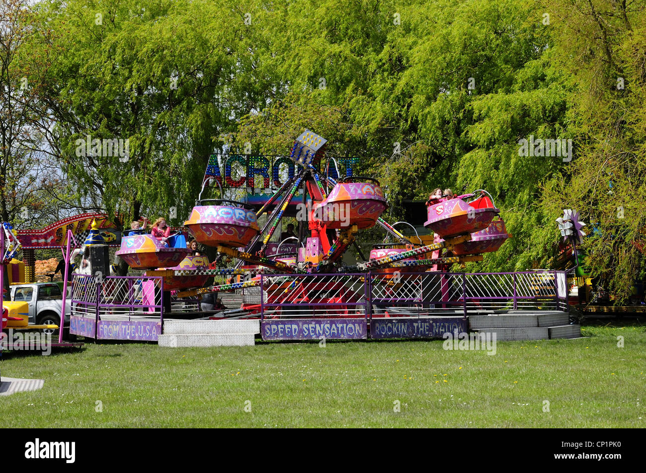 Operating fairground ride with passengers Stock Photo - Alamy