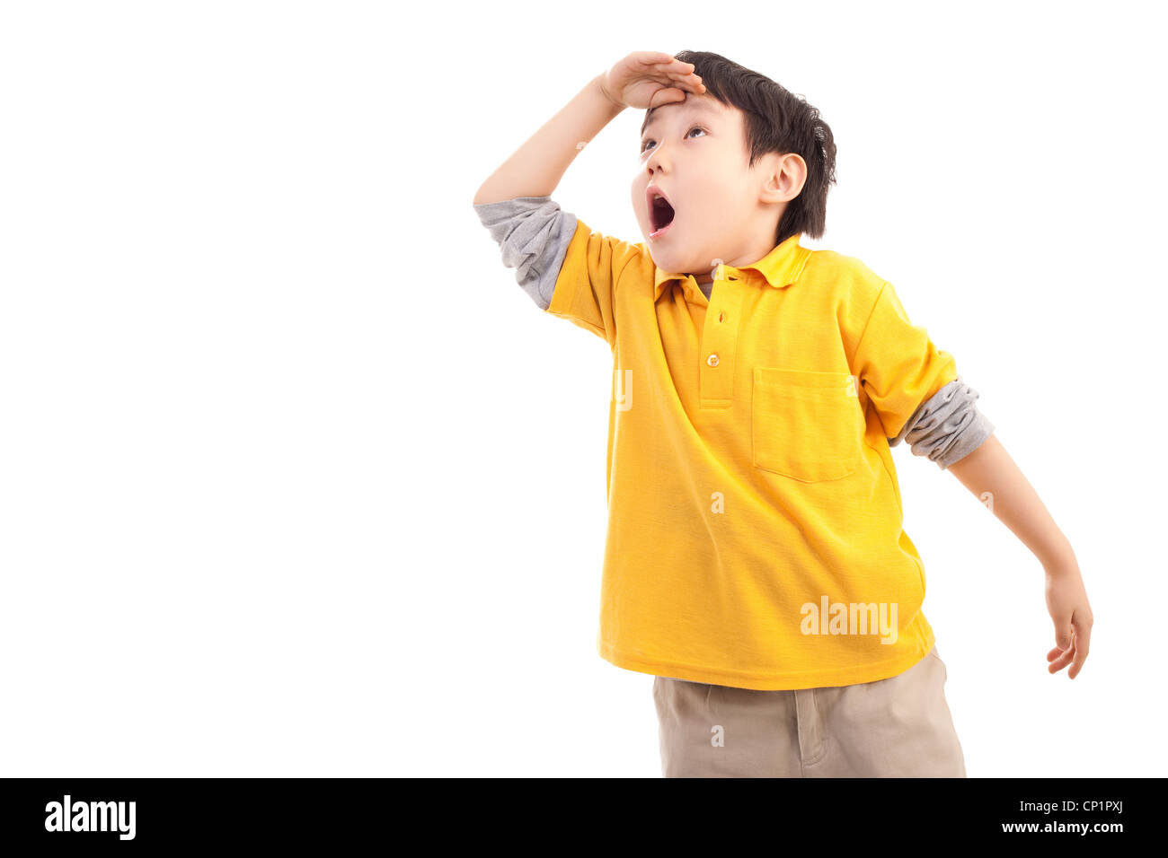 Cute boy looking afar Stock Photo - Alamy