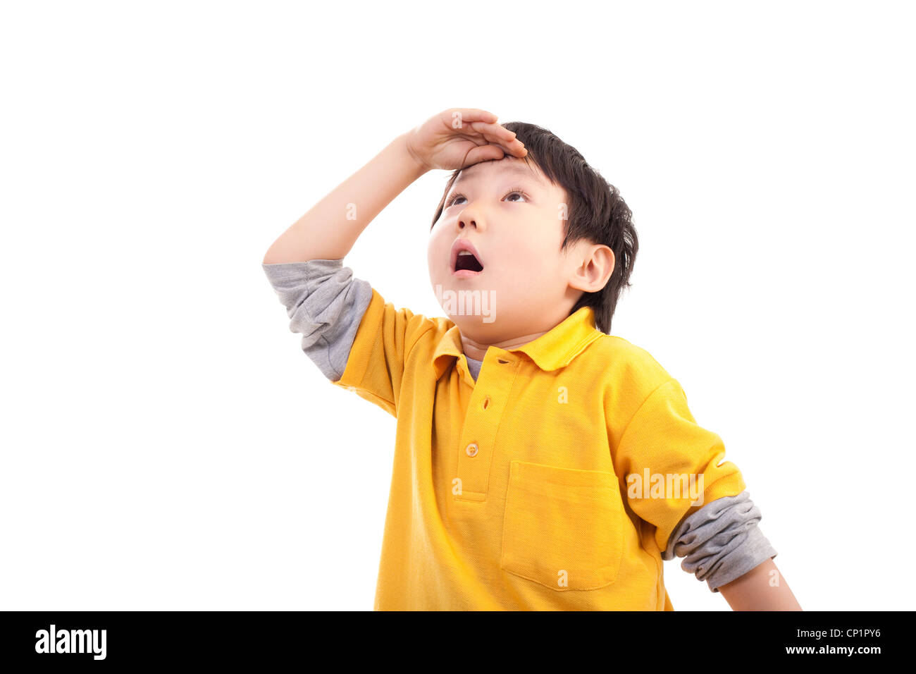 Cute boy looking afar Stock Photo - Alamy
