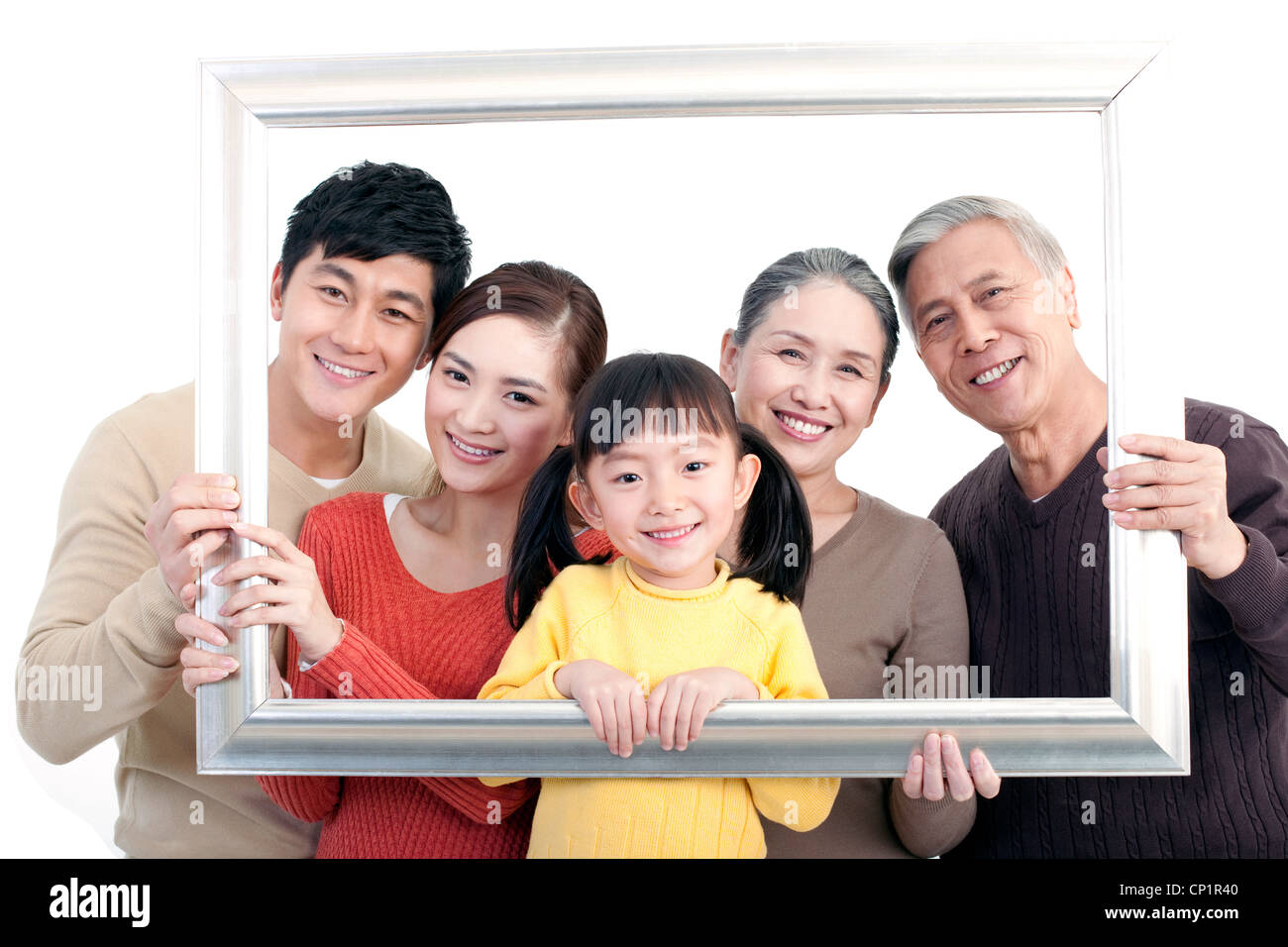 Happy family and picture frame Stock Photo - Alamy