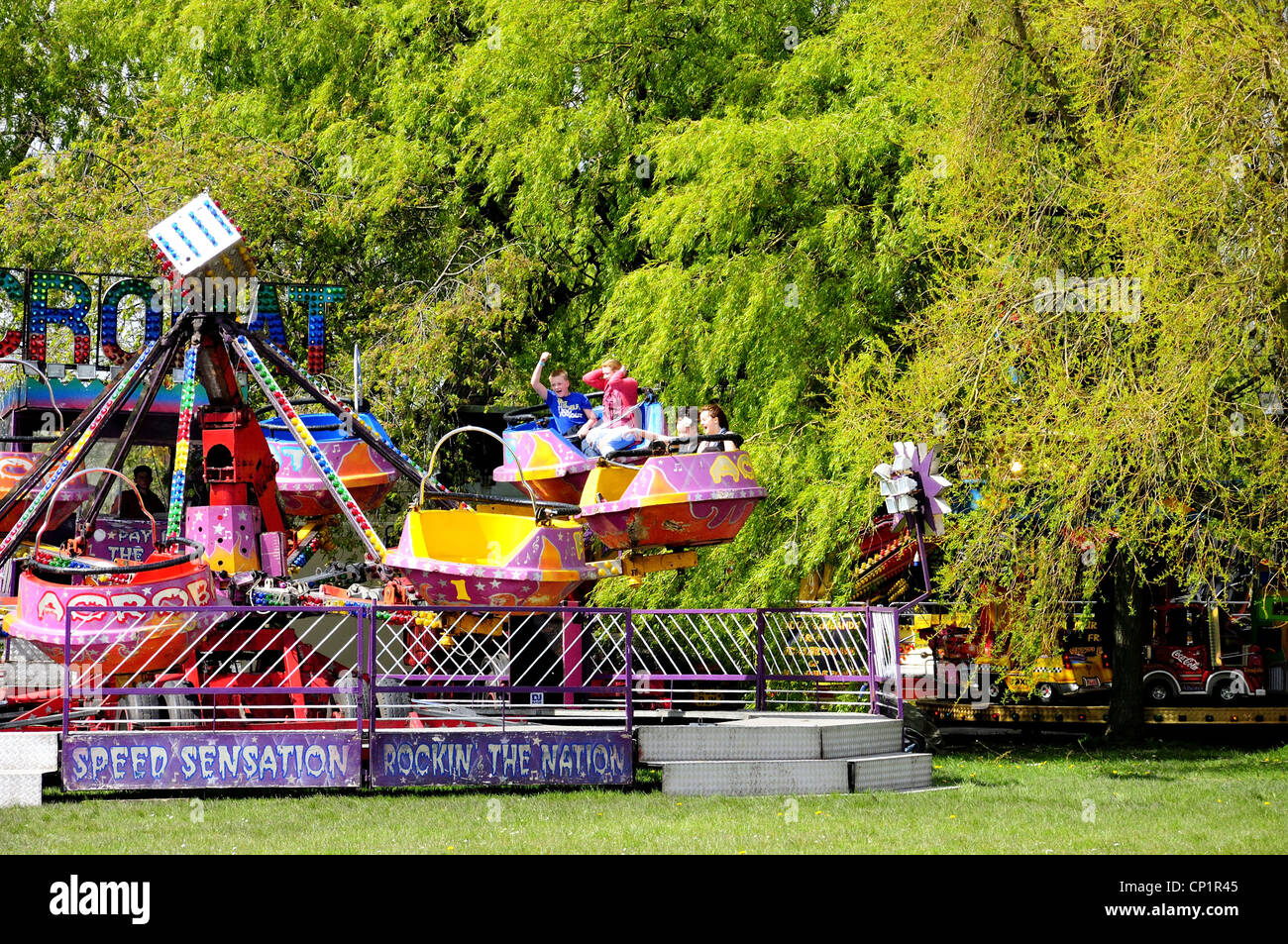 Operating fairground ride with passengers Stock Photo - Alamy