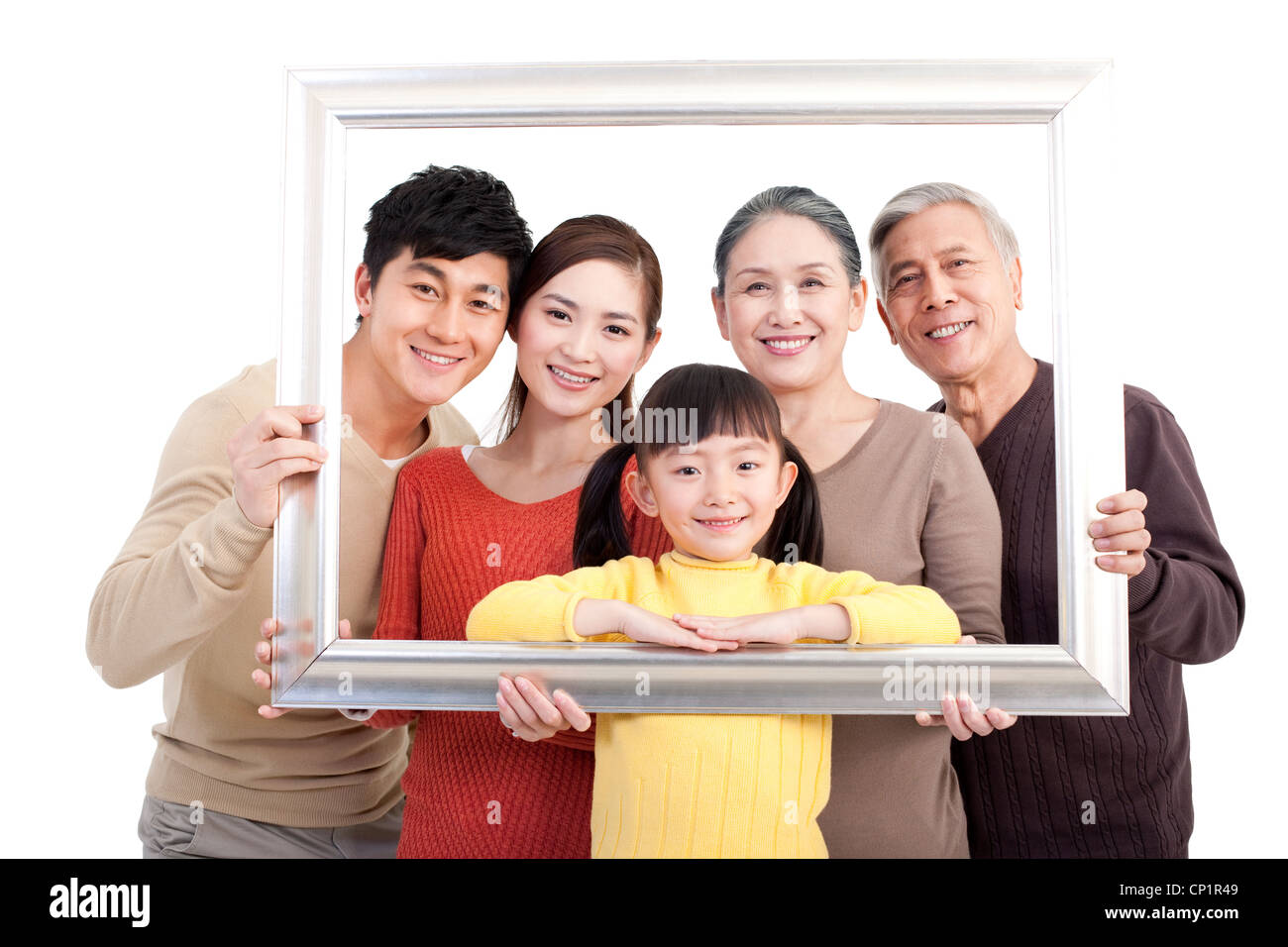 Happy family and picture frame Stock Photo - Alamy