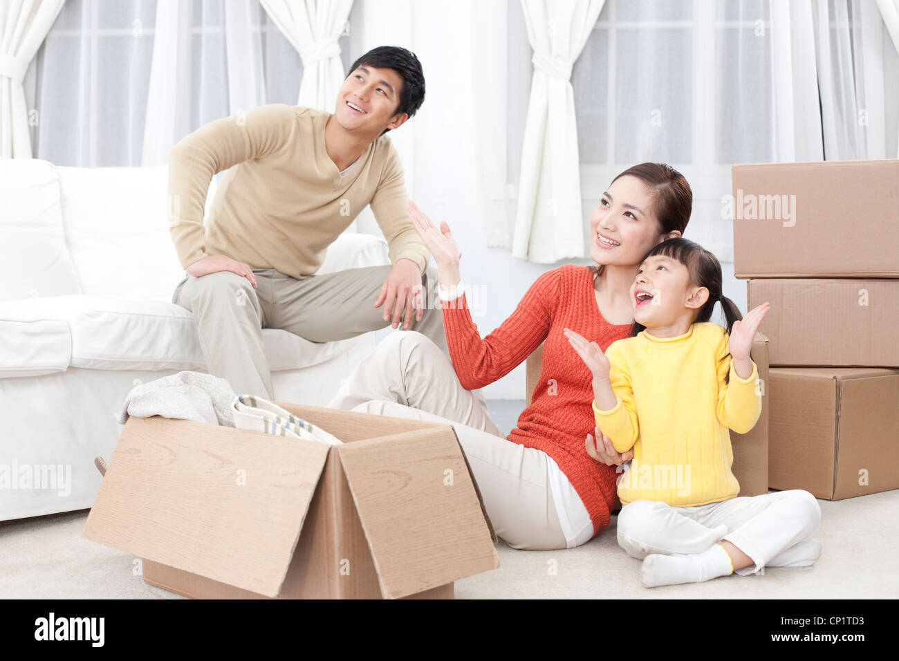 Family moving to a new house Stock Photo - Alamy