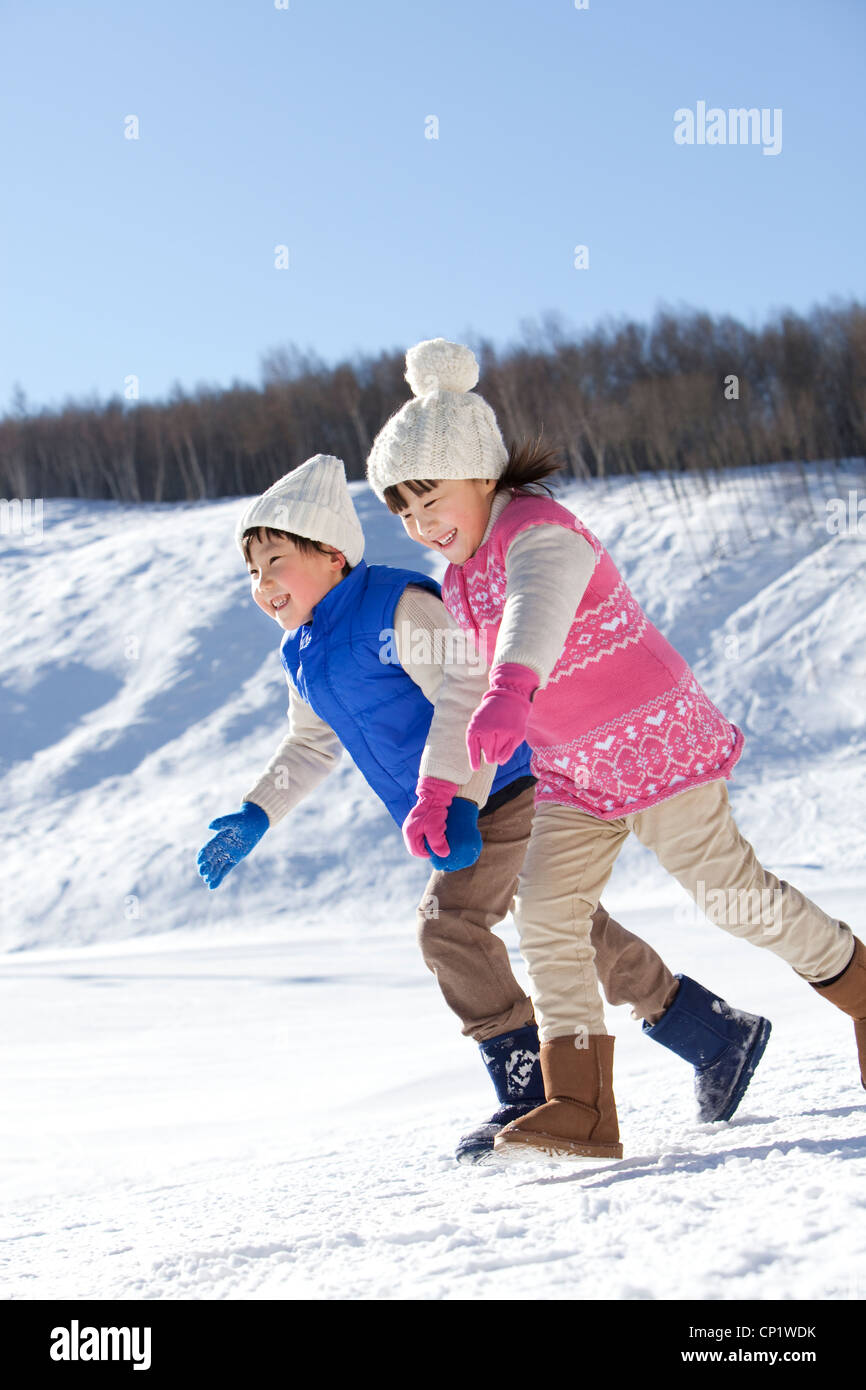 Children having fun in snow Stock Photo - Alamy
