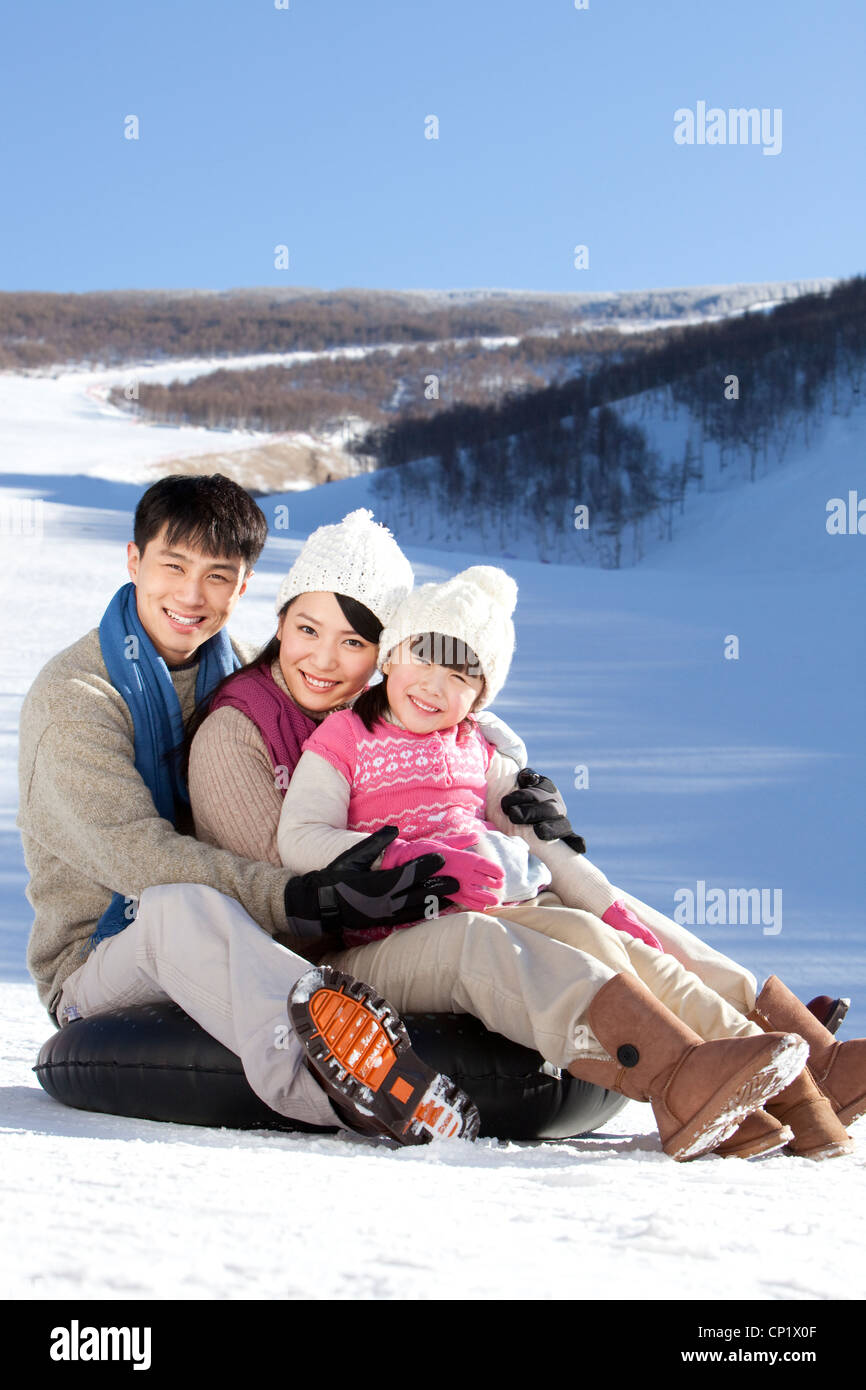 Family having fun in snow Stock Photo - Alamy