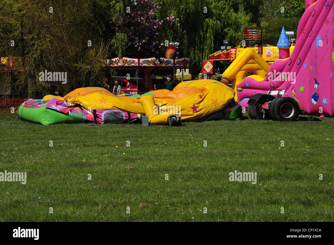 Inflatable bouncy house, 'Jump and Smile', being blown up by air ...
