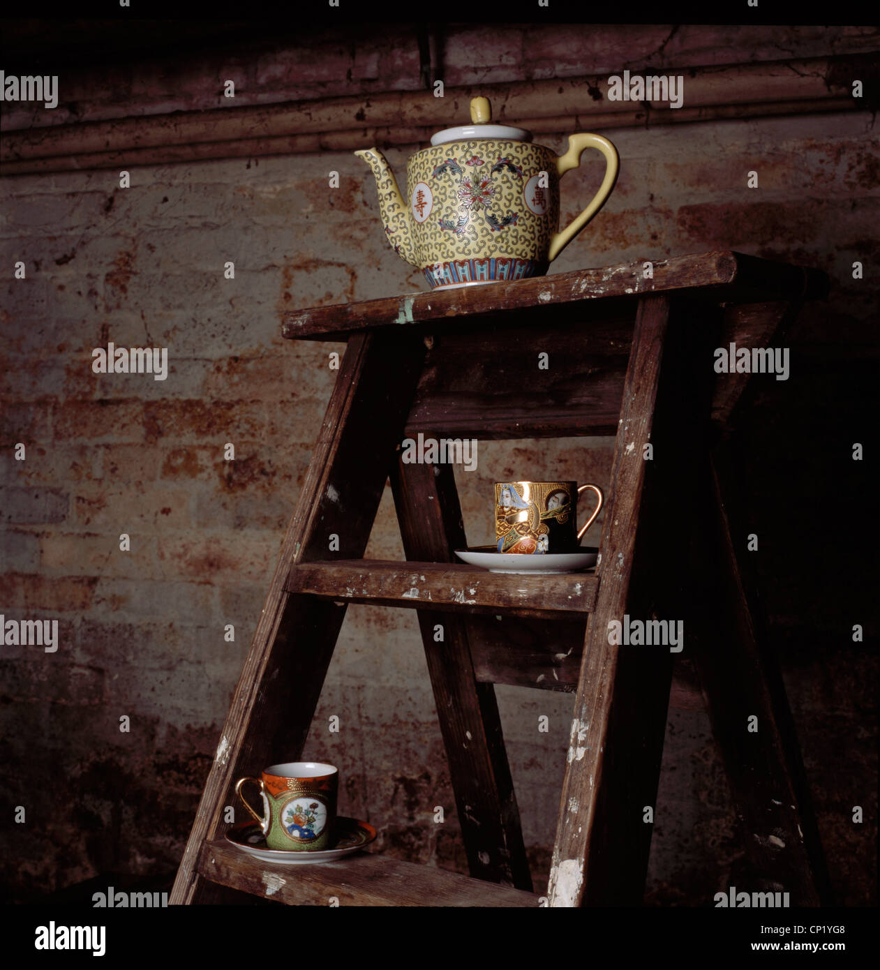 Still life - Ladder, teacups Stock Photo - Alamy