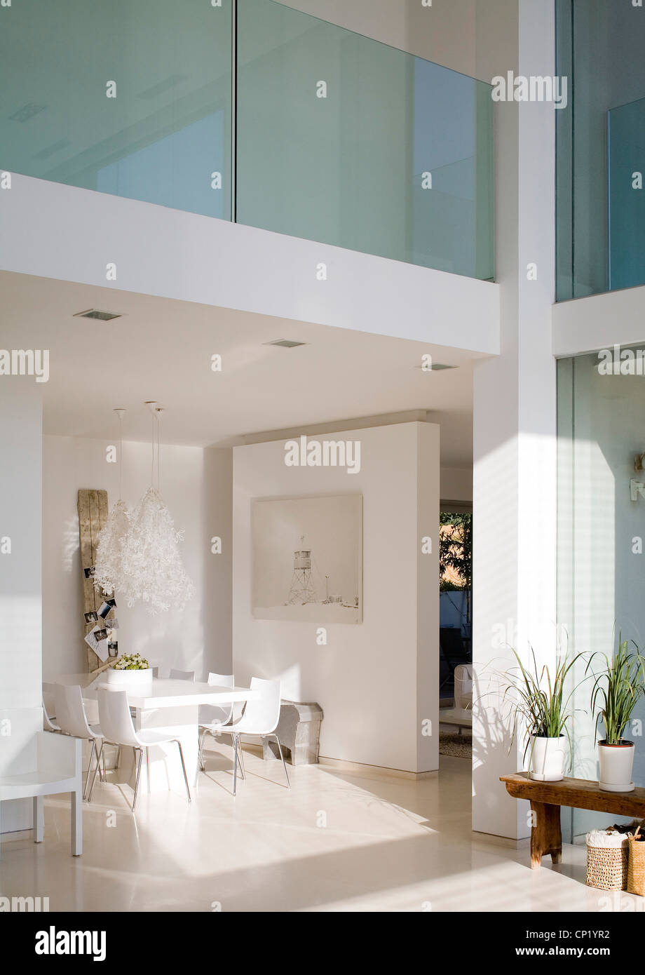 Open plan dining area in double height interior, Rishpon, Israel ...