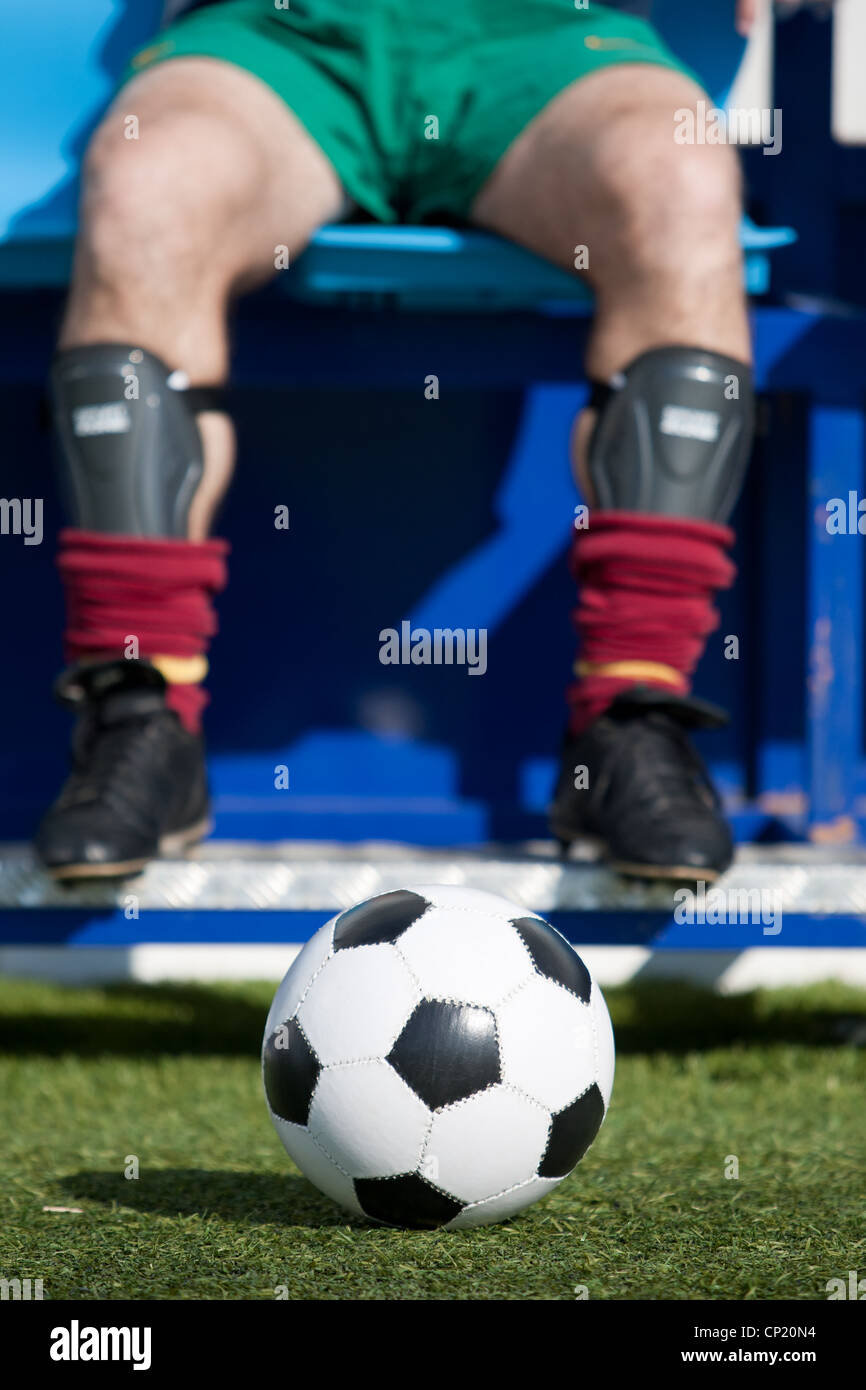 soccer substitute player preparing to enter the game, focus on the ball ...