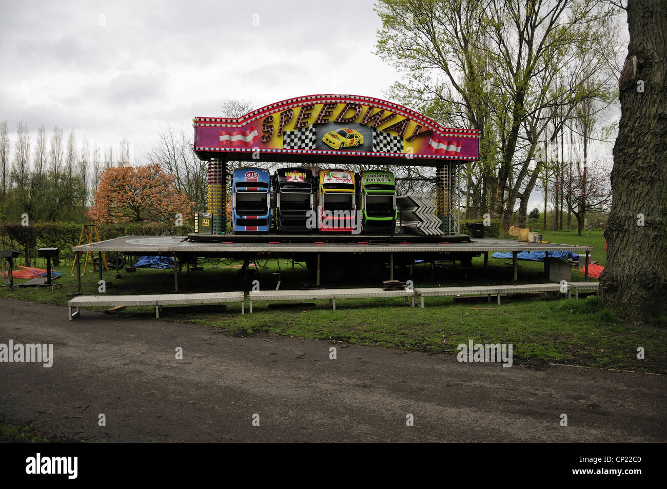 'Speedway' children's car ride being unpacked and assembled before fair ...