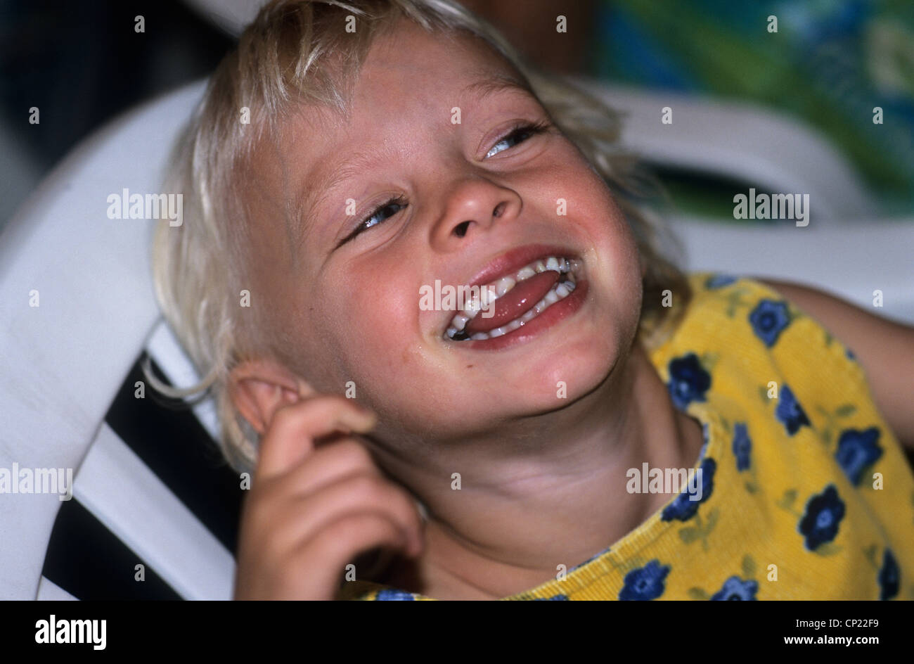 Young girl giggling Stock Photo - Alamy