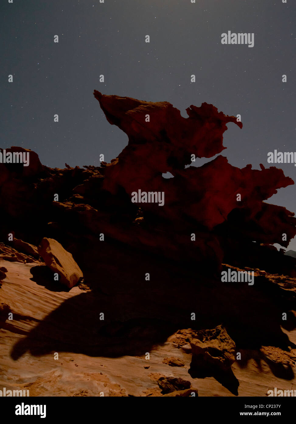 The eroded sandstone shapes of Devil's Fire come alive on a full moon ...