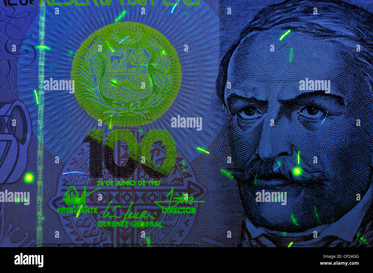 Banknote under ultraviolet light showing security features invisible in ...