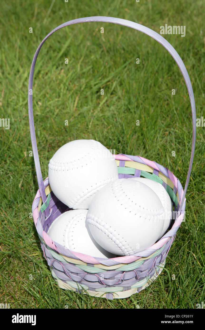 Softball balls in a easter basket on grass Stock Photo - Alamy