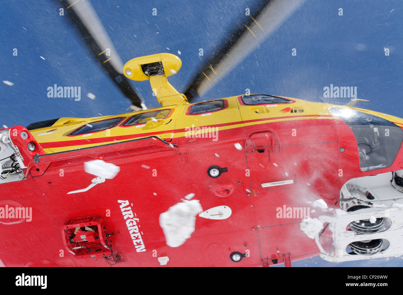 Close up of a rescue helicopter taking off in winter Stock Photo - Alamy