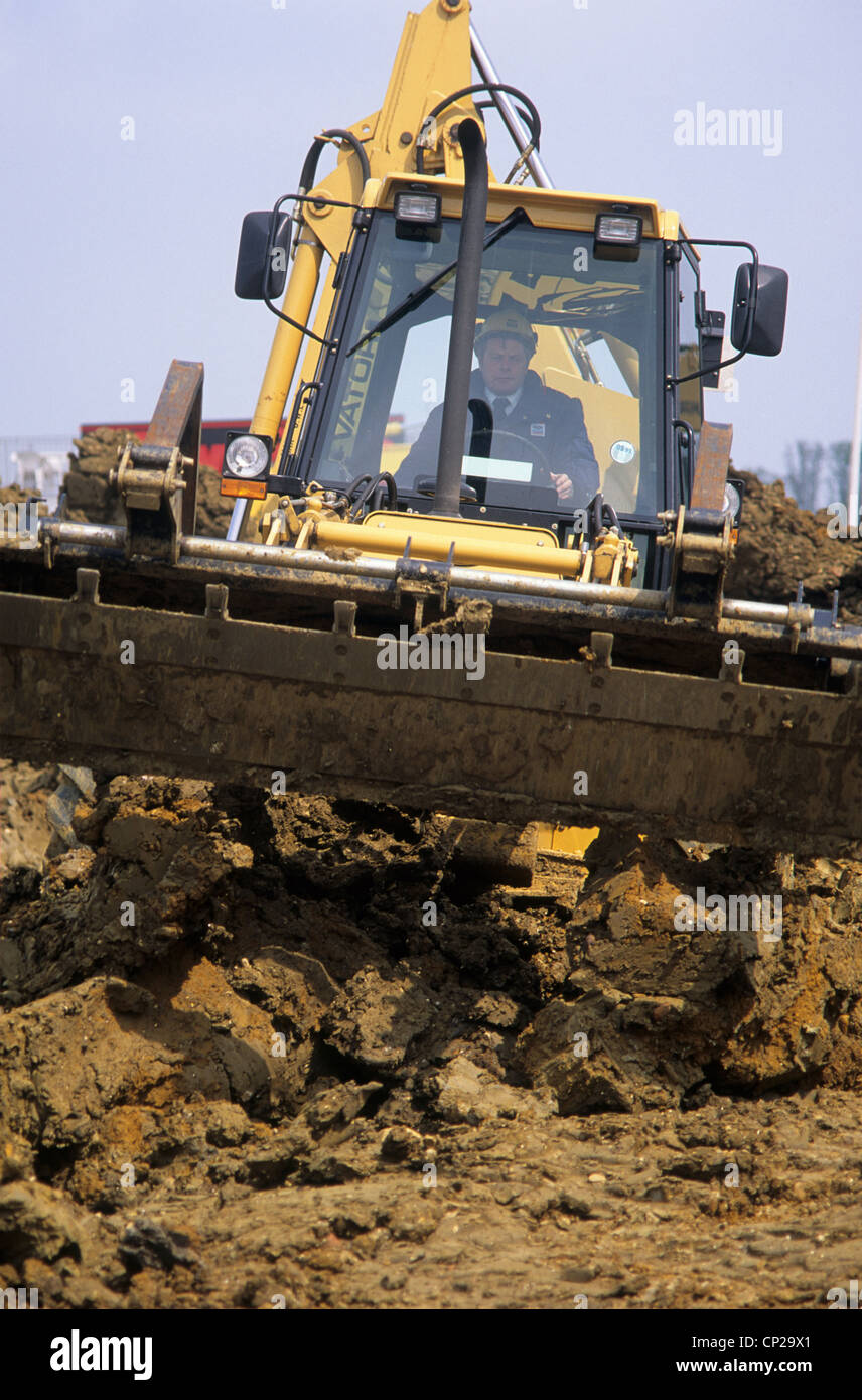 Industrial, Man operating JCB on site Stock Photo - Alamy