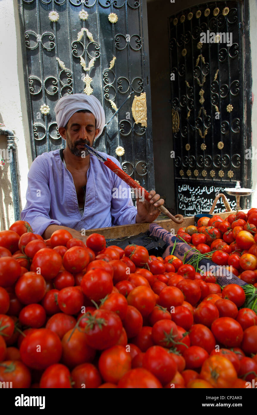 An Egyptian from Luxor smoking a chicha in the old market Stock Photo ...