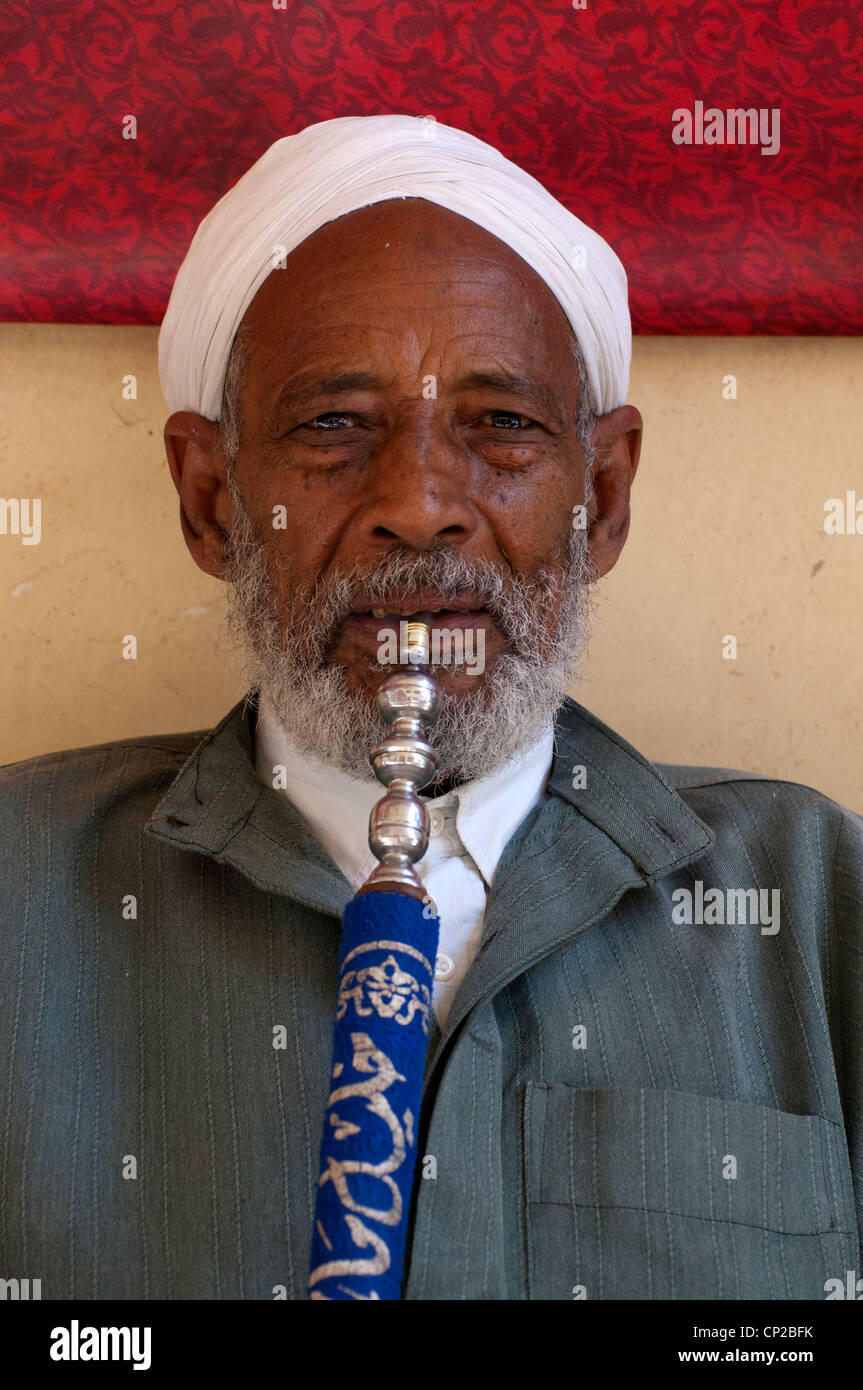 An Egyptian from Luxor smoking a chicha in the old market Stock Photo ...