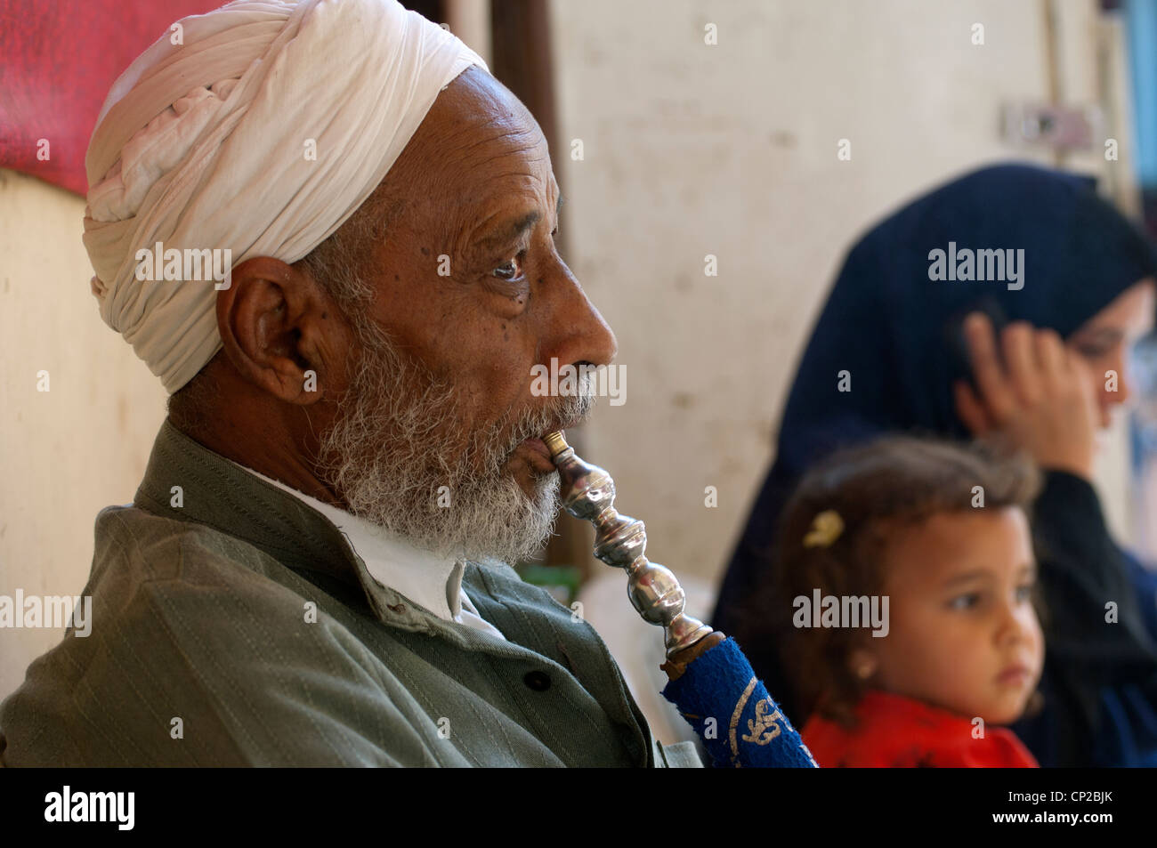 An Egyptian from Luxor smoking a chicha in the old market Stock Photo ...