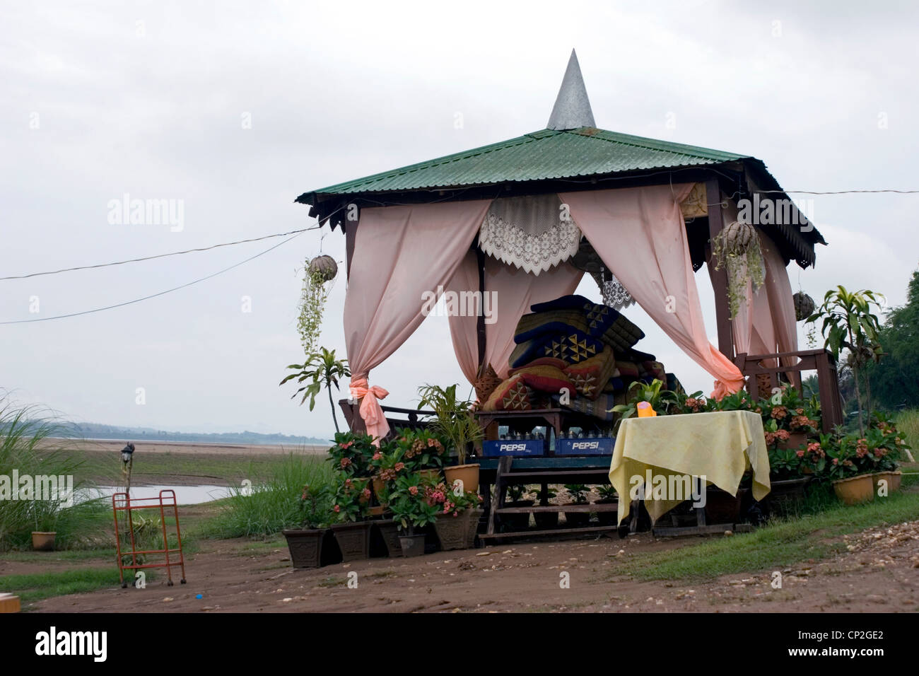 A small wooden bar serves drinks to tourists and residents alike on the ...