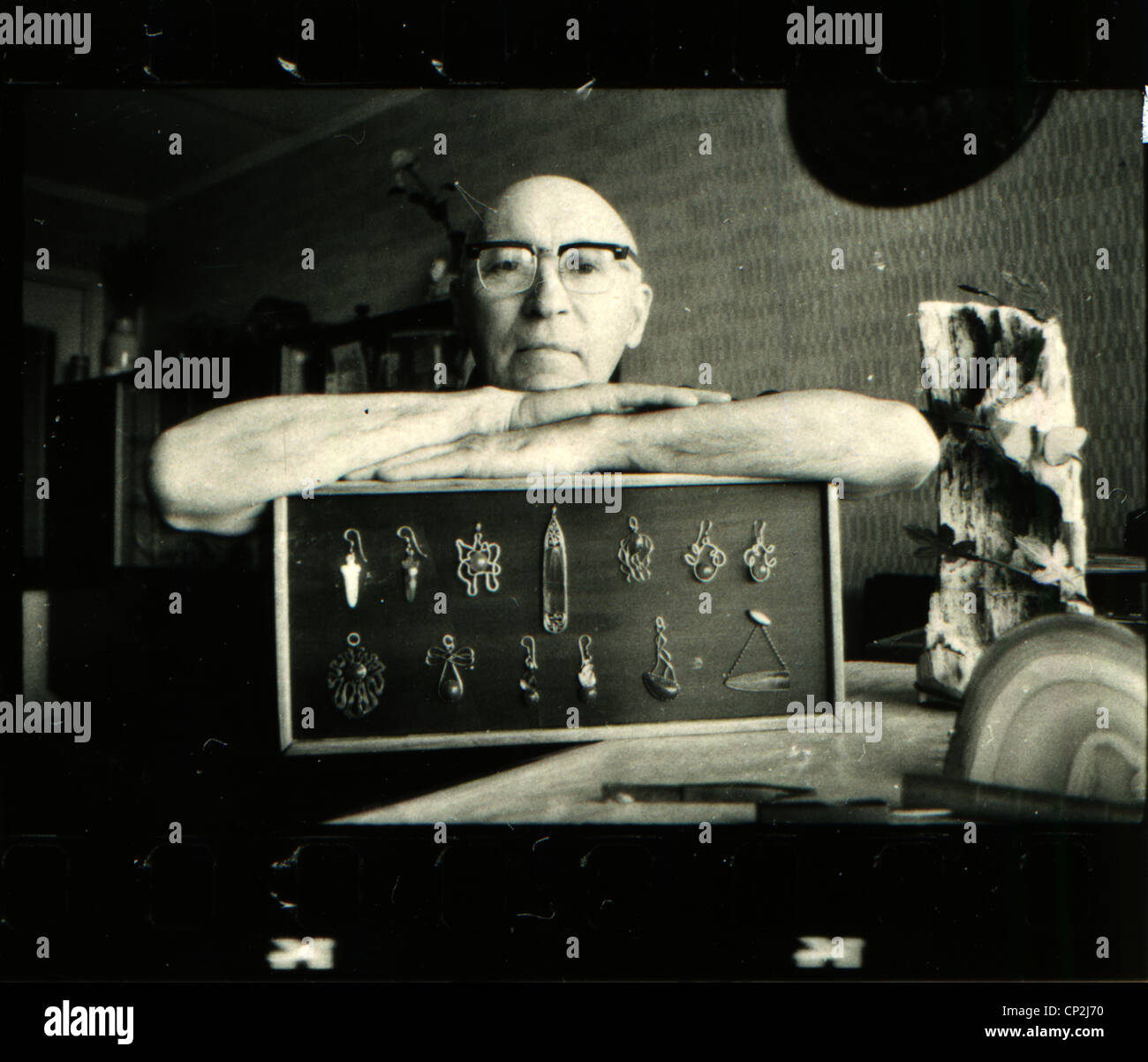 portrait of a goldsmith, who kept his jewelry Stock Photo - Alamy