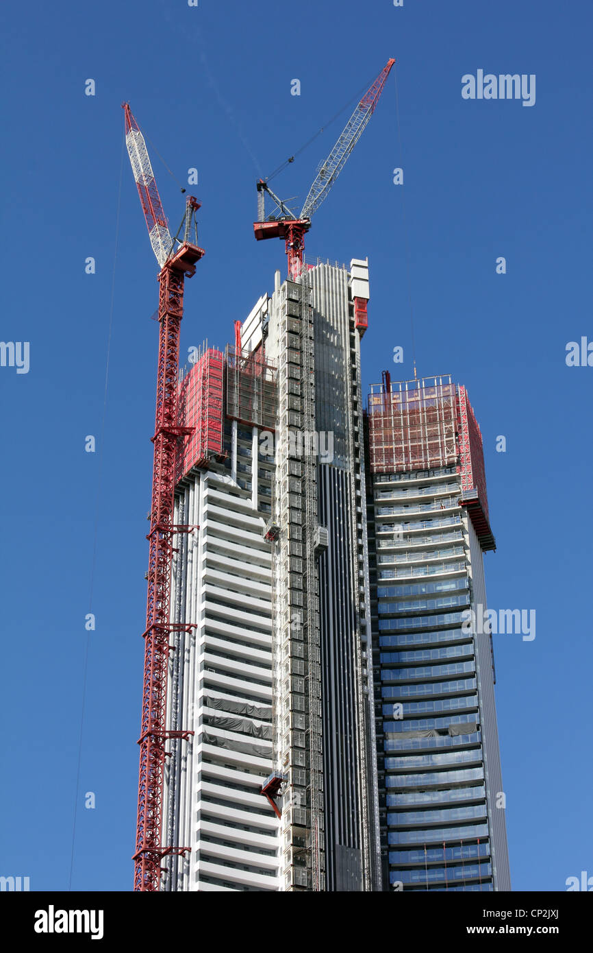 CONSTRUCTION OF A HIGH RISE RESIDENTIAL TOWER WITH CRANES AGAINST A ...