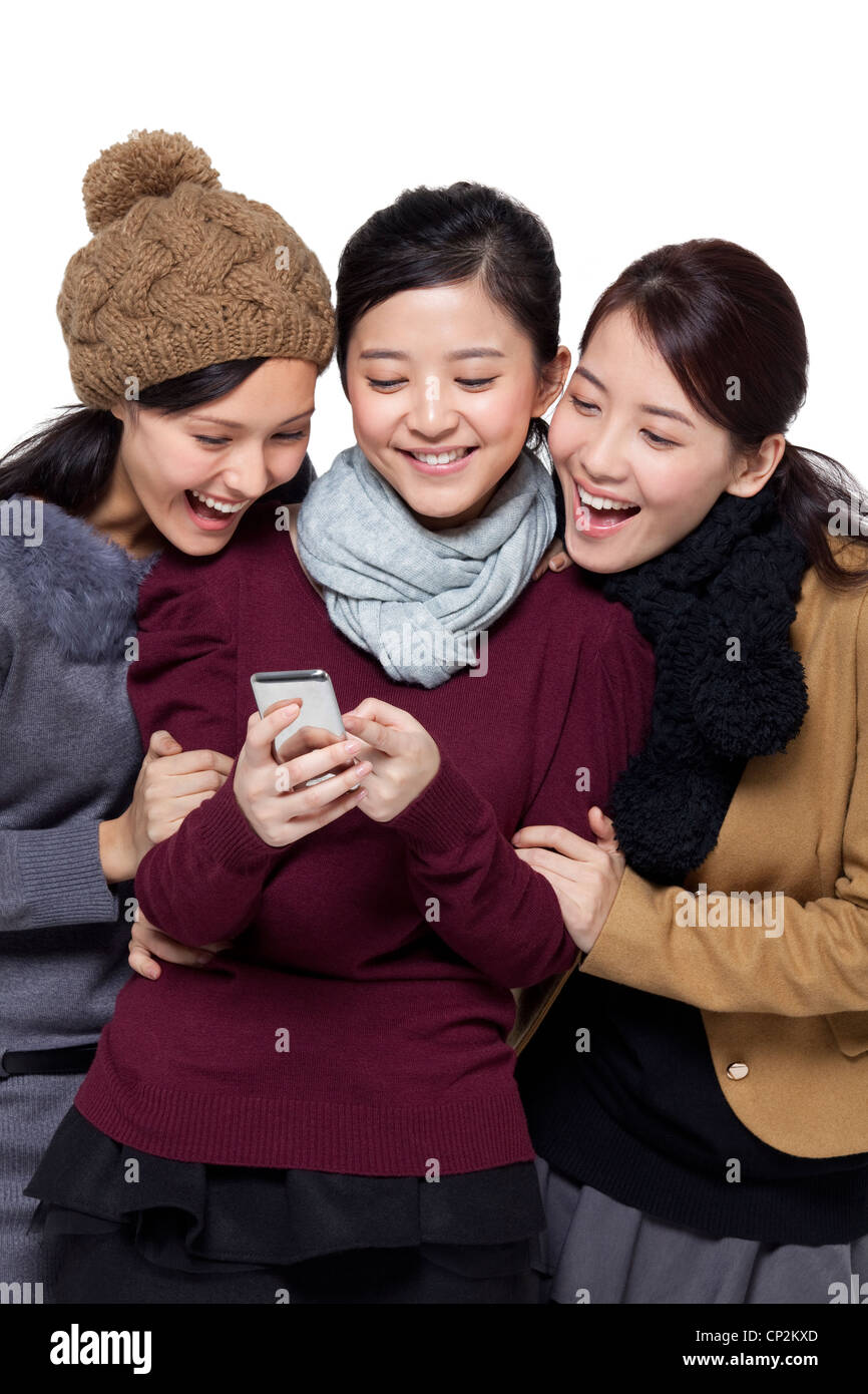 Young women using mobile phone Stock Photo - Alamy