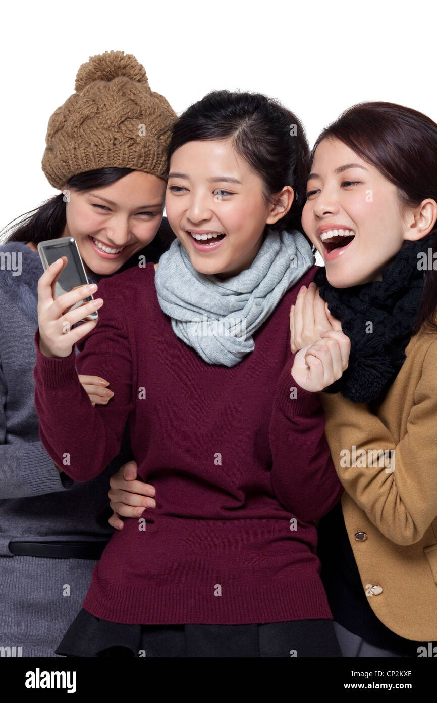 Young women using mobile phone Stock Photo - Alamy