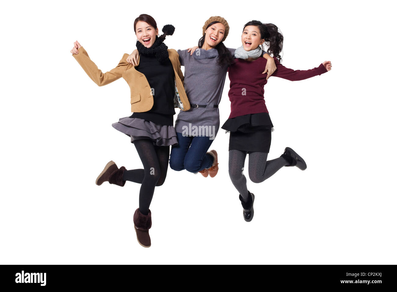 Young women jumping in mid-air Stock Photo - Alamy