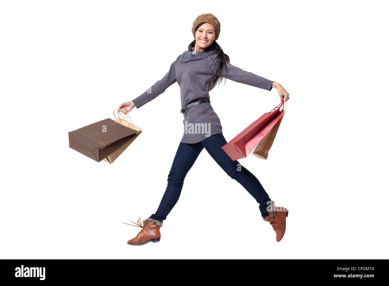Stylish young woman going shopping Stock Photo - Alamy