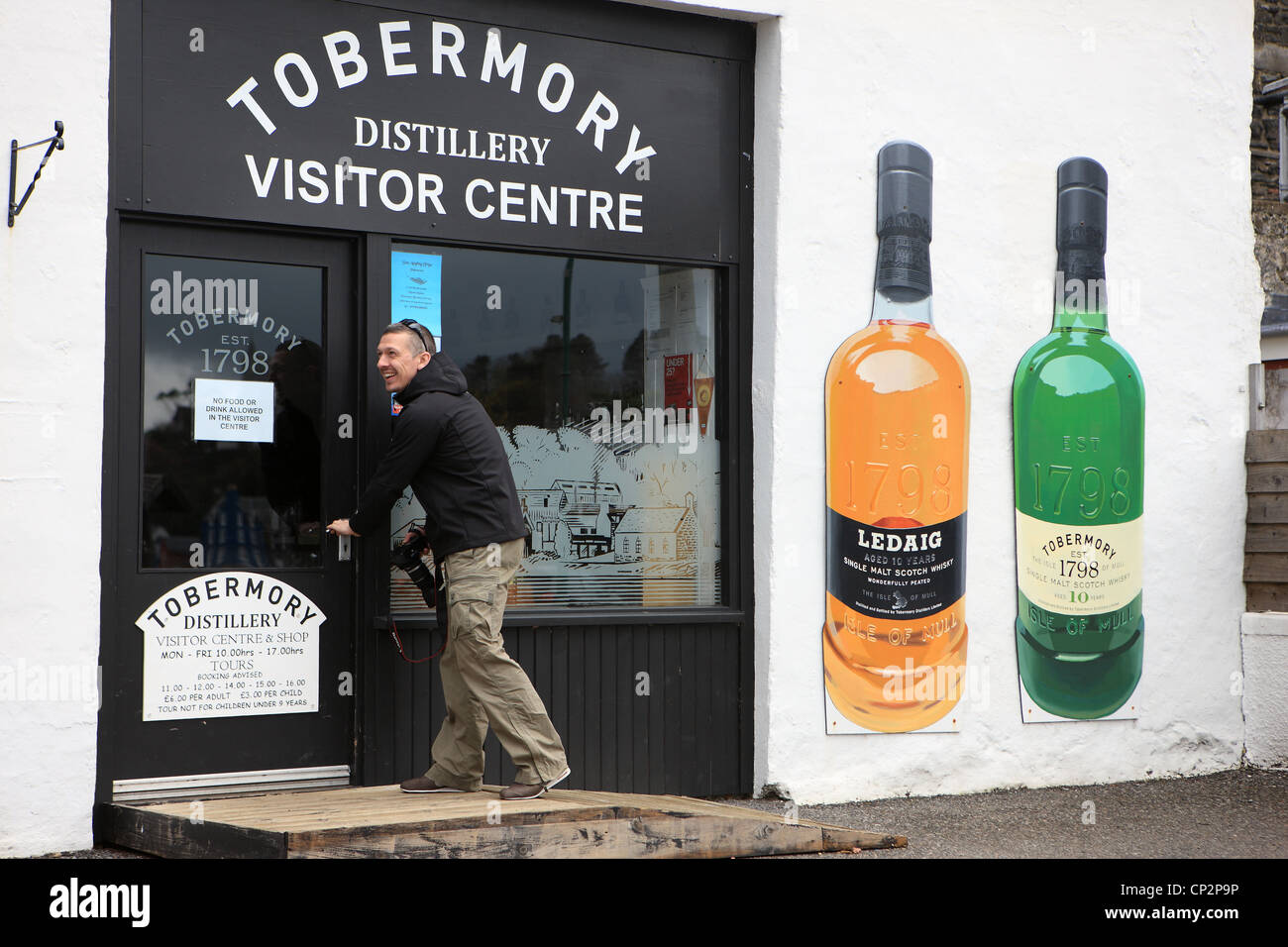 Man entering the Tobermory Distillery Centre in Tobermory on the Isle ...