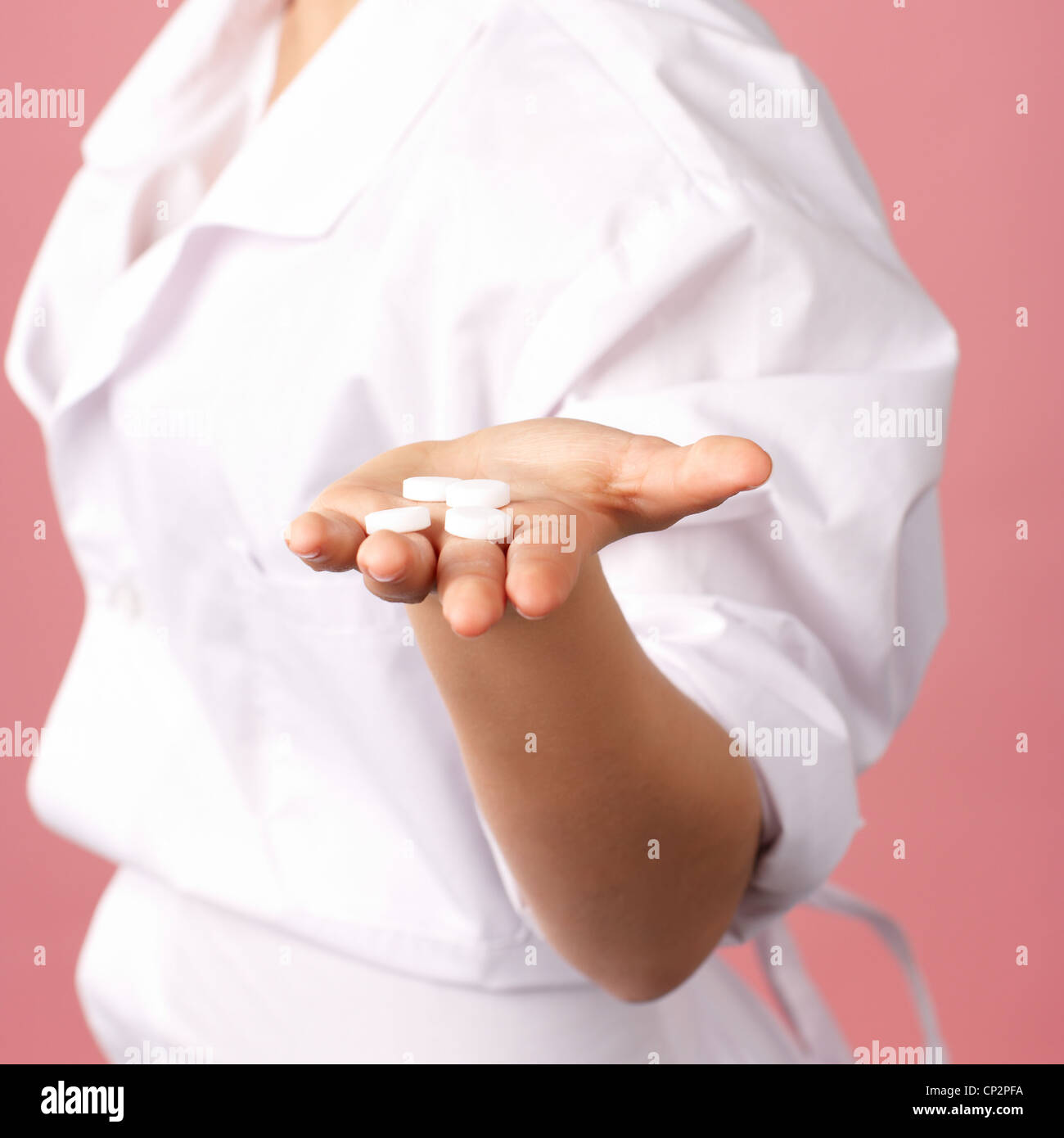 Doctor giving pill hand pills hi-res stock photography and images - Alamy