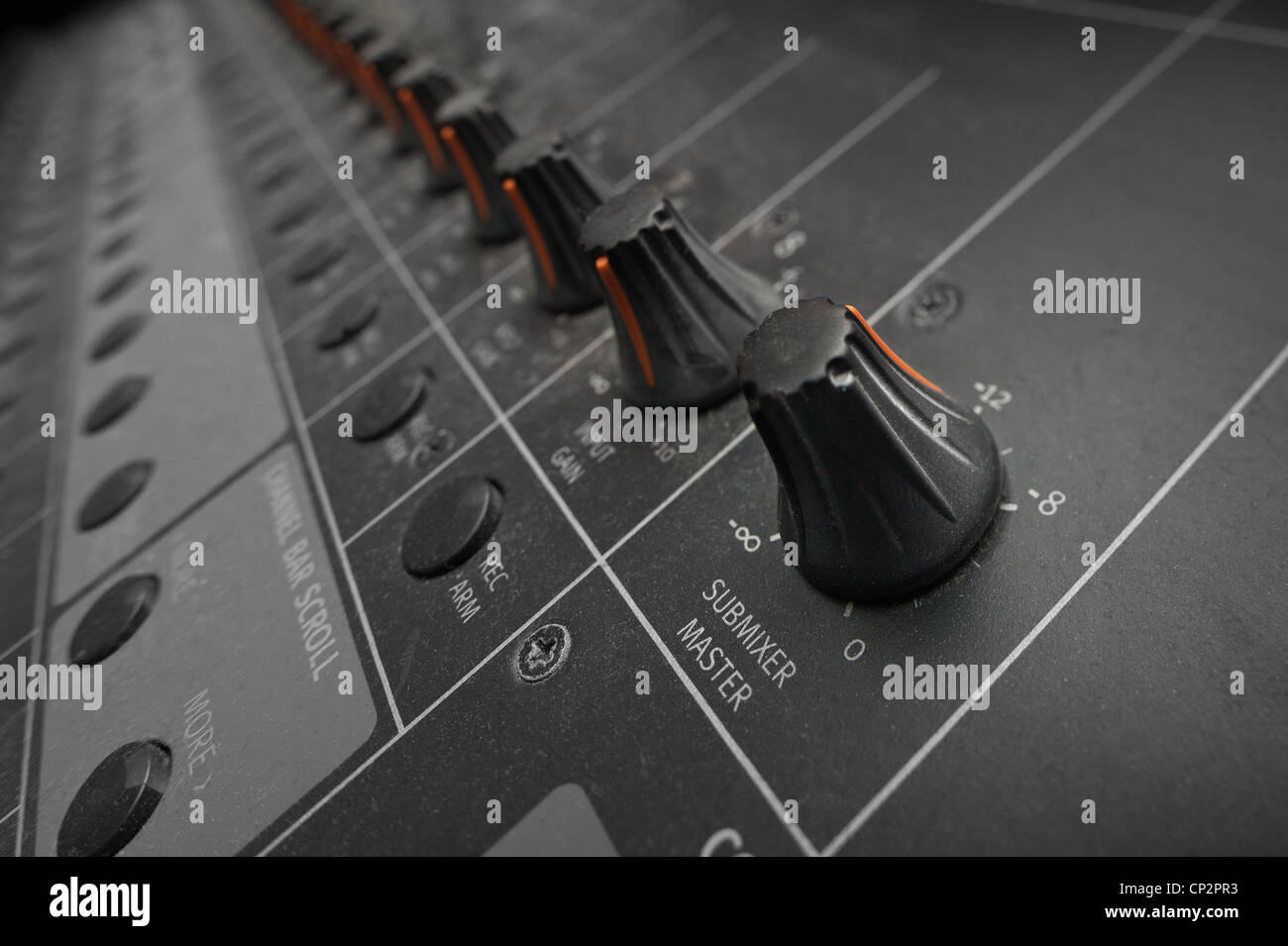 Electronic sound audio mixing desk console in recording studio showing ...