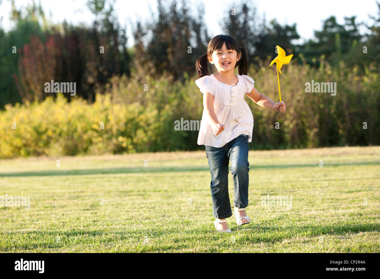 Girl With A Pinwheel High Resolution Stock Photography and Images - Alamy