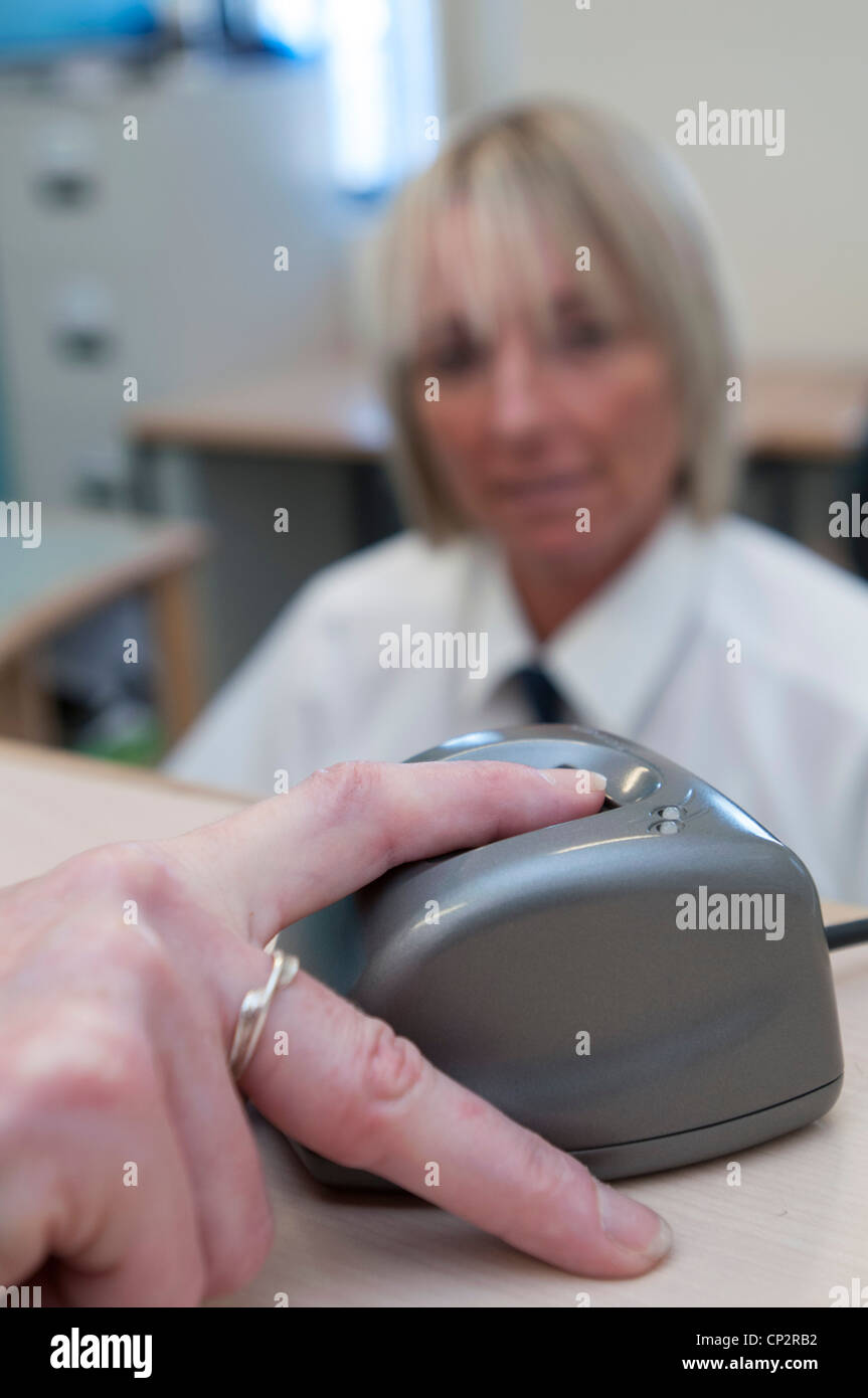 Electronic finger scan Stock Photo - Alamy