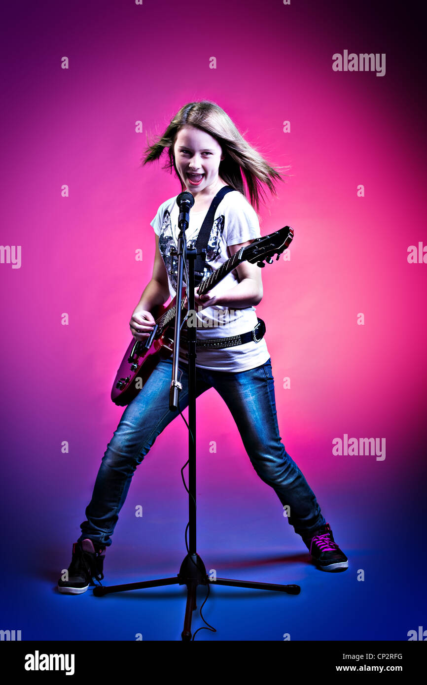 portrait of young girl with a guitar on the stage Stock Photo - Alamy