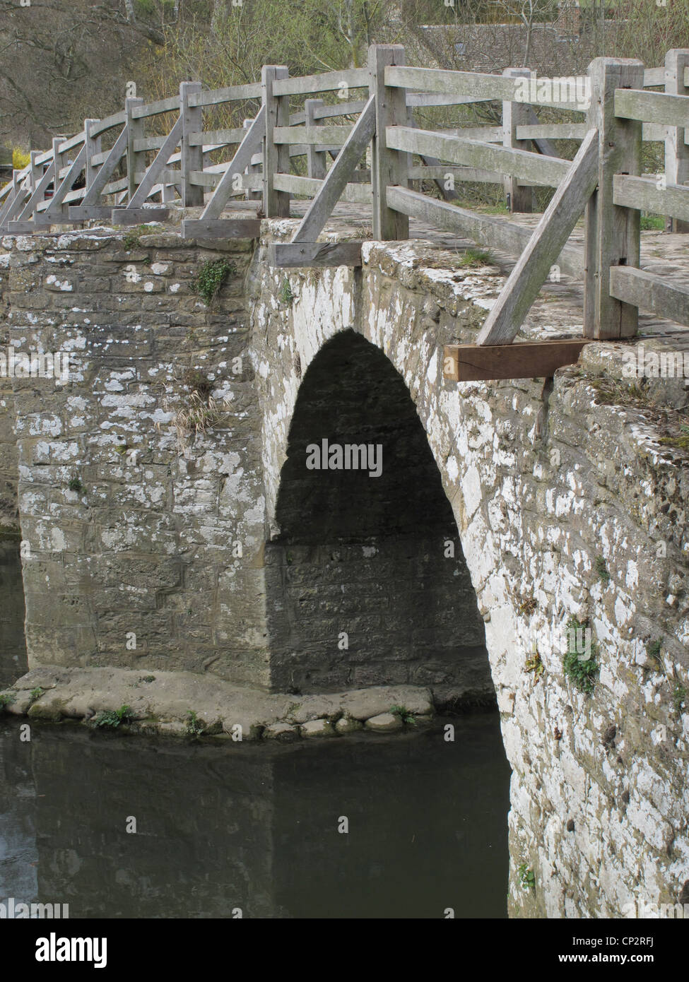 Stone bridge over the river Rode in a village in Wiltshire, England, UK ...