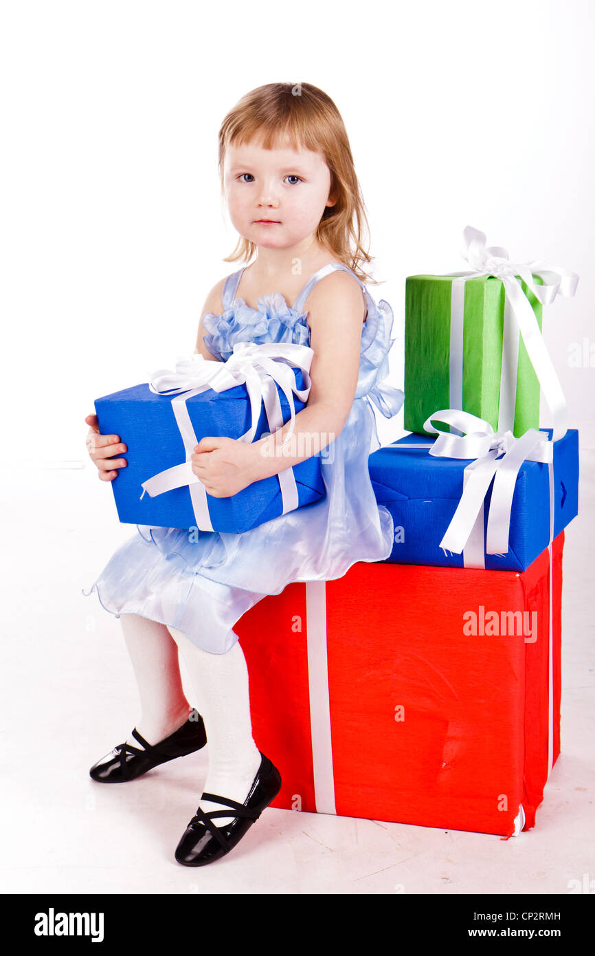 Beautiful little girl with presents over white background Stock Photo ...