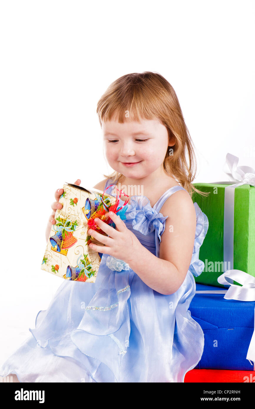 Beautiful little girl with presents over white background Stock Photo ...
