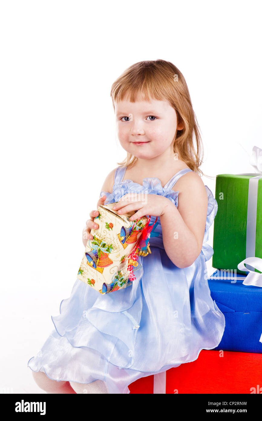 Beautiful little girl with presents over white background Stock Photo ...
