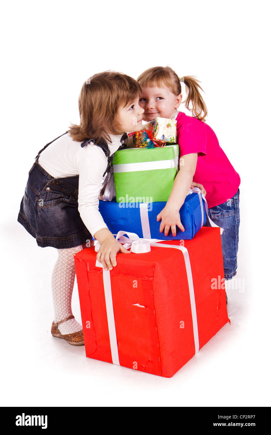Two little girls with gift boxes isolated on white Stock Photo - Alamy