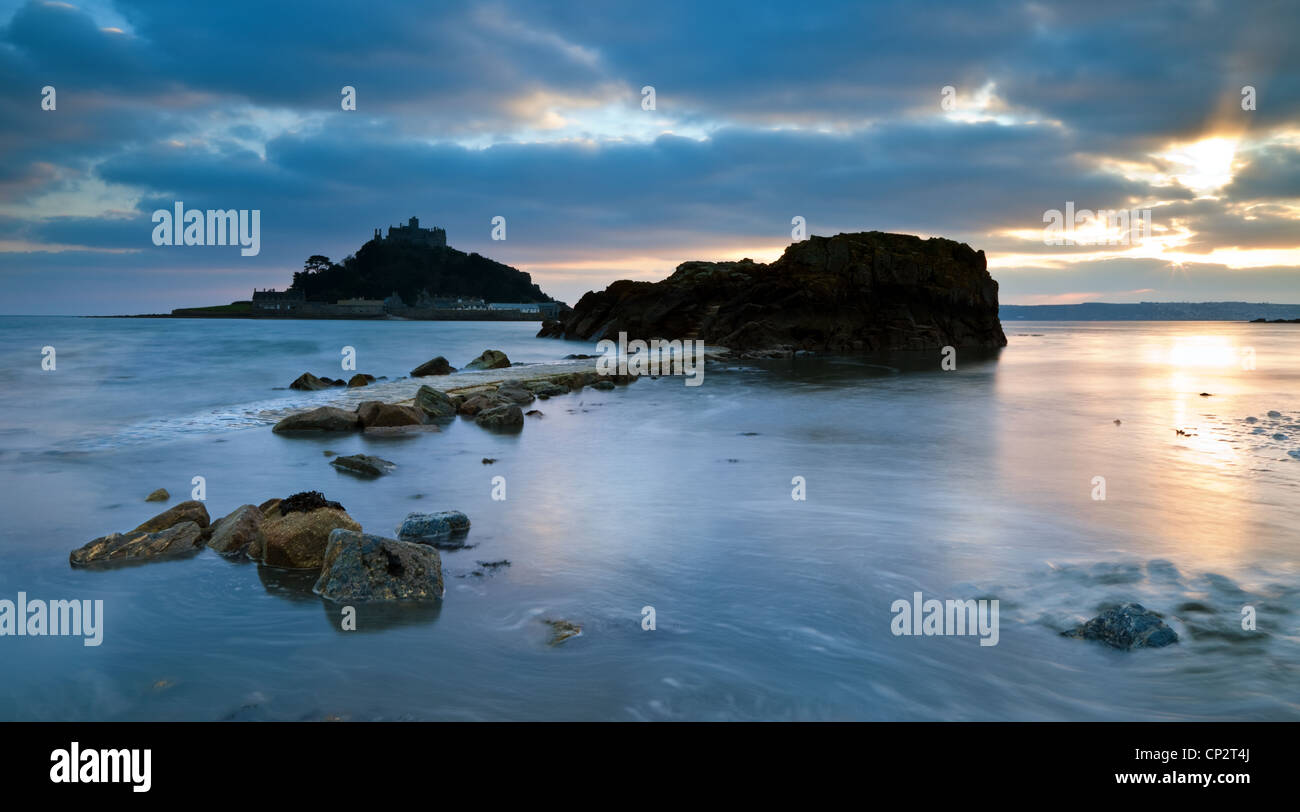 St Michaels mount slowly slips into to silhouette from the setting sun ...