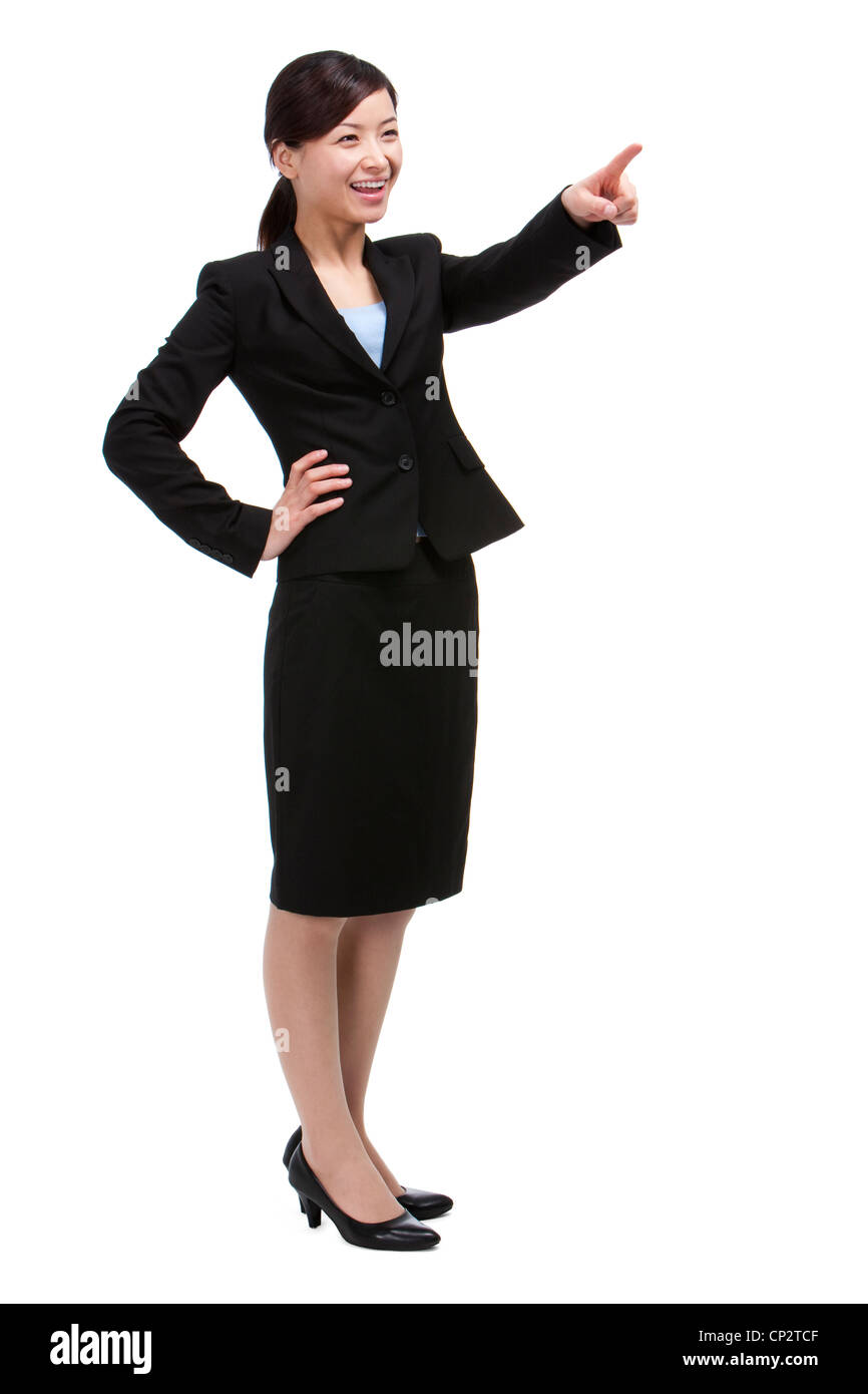 Businesswoman pointing the front Stock Photo - Alamy