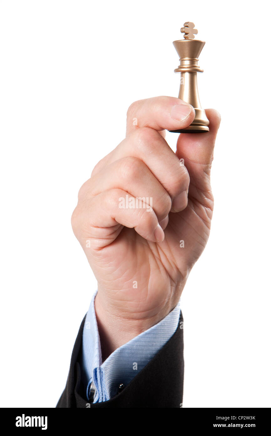 Businessman's hand holding chess Stock Photo - Alamy