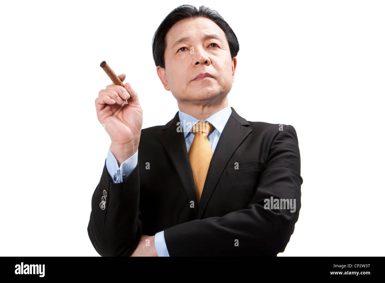 Senior businessman smoking a cigar Stock Photo - Alamy