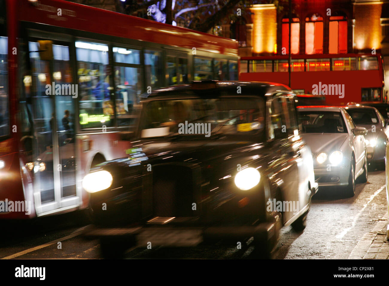 Taxi in the street of London. Cabs are the most iconic symbol of London ...