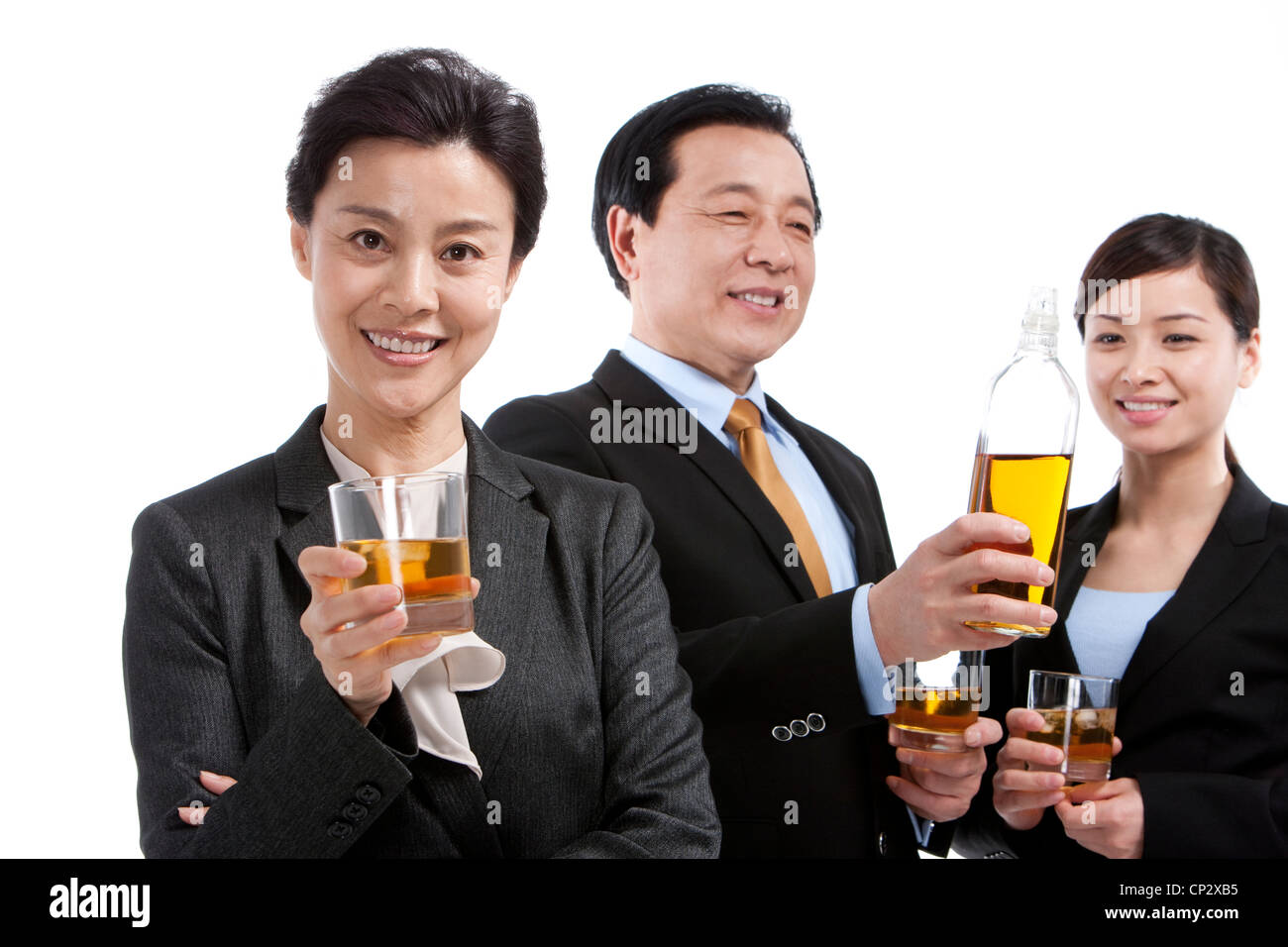 Business team enjoying whiskey Stock Photo - Alamy