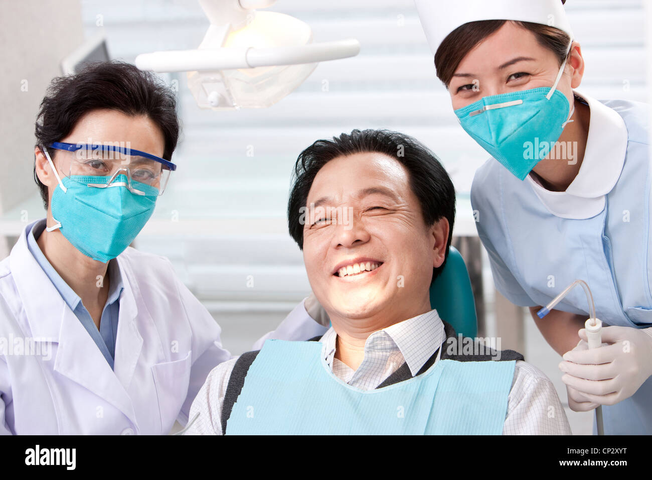 Patient receiving treatment in dental clinic Stock Photo - Alamy